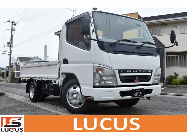 三菱ふそう キャンター全低床DX ディーゼル PS PW 5MT 平ボディの中古車 車体価格169万円 2006(平成18)年式 走行0.7万キロ 車体色ホワイト 大阪府堺市北区金岡町2557 ...