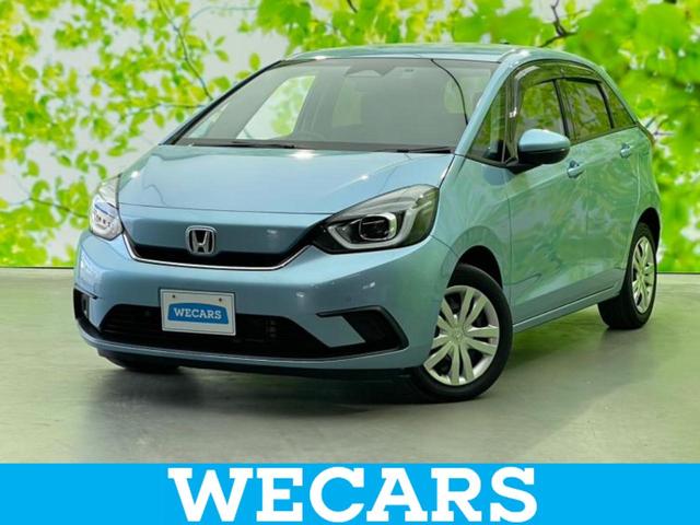 ホンダ フィット eHEVホーム 新品タイヤ／保証書／純正 9インチ SDナビ／衝突安全装置／車線逸脱防止支援システム／シート ハーフレザー／パーキングアシスト バックガイド／ヘッドランプ ...